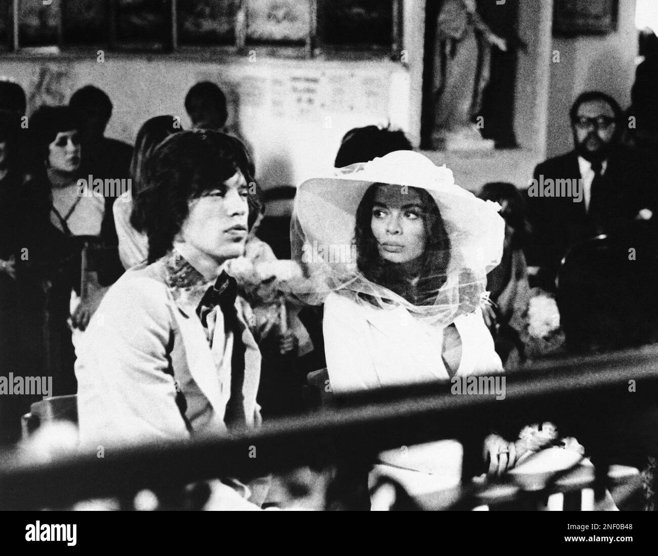 Rolling Stones singer Mick Jagger, left, is shown with his new bride ...