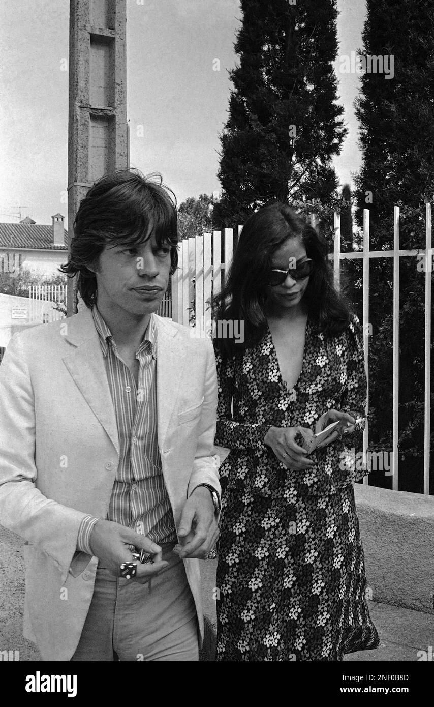 Mick Jagger of the Rolling Scones takes a stroll with his fiance Bianca ...