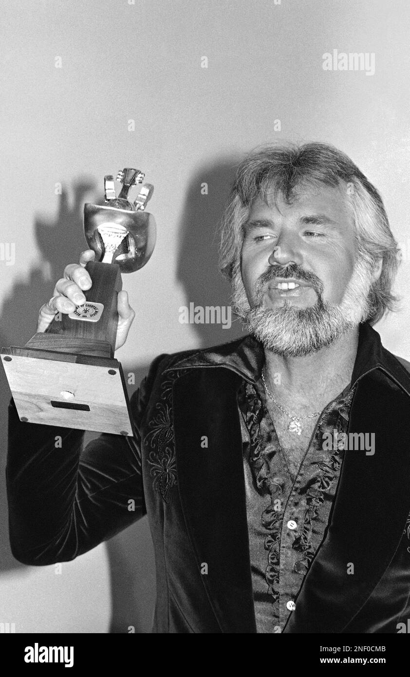Country singer Kenny Rogers holds his Academy of Country Music Award ...