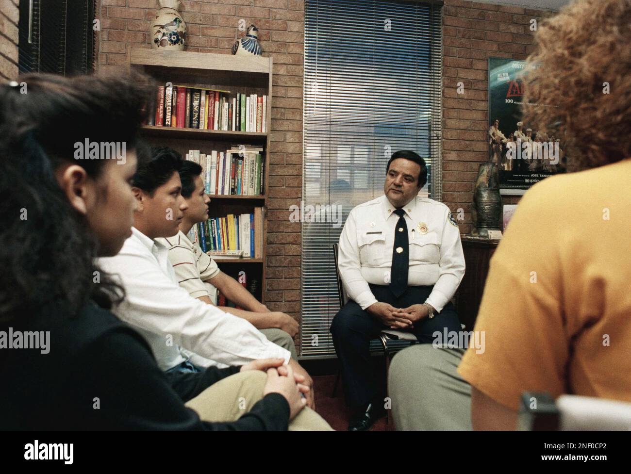 Houston Fire Marshal Eddie Corral, right, is a counseling session with ...
