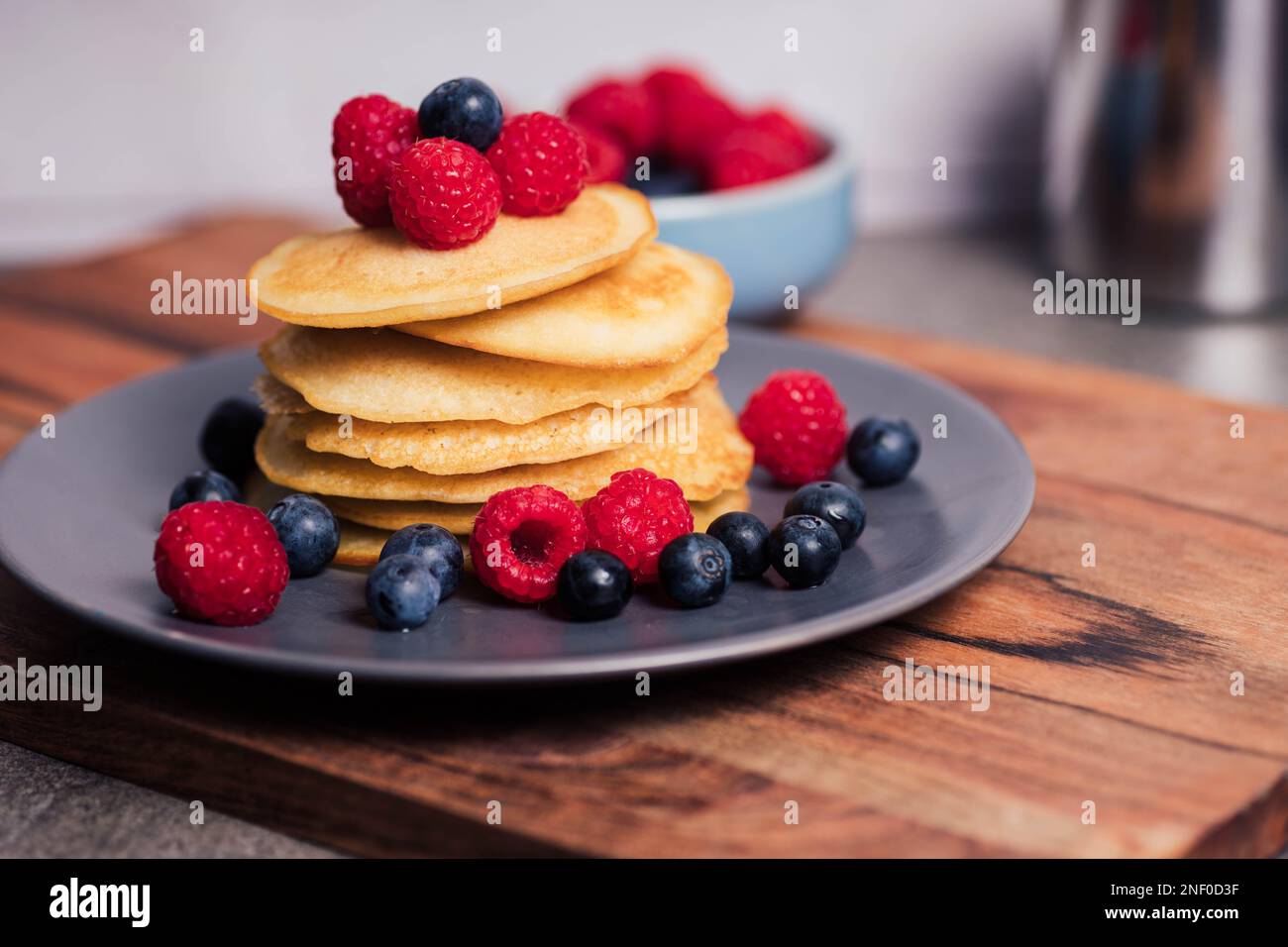 Stack pancakes honey sauce blueberries hi-res stock photography and ...