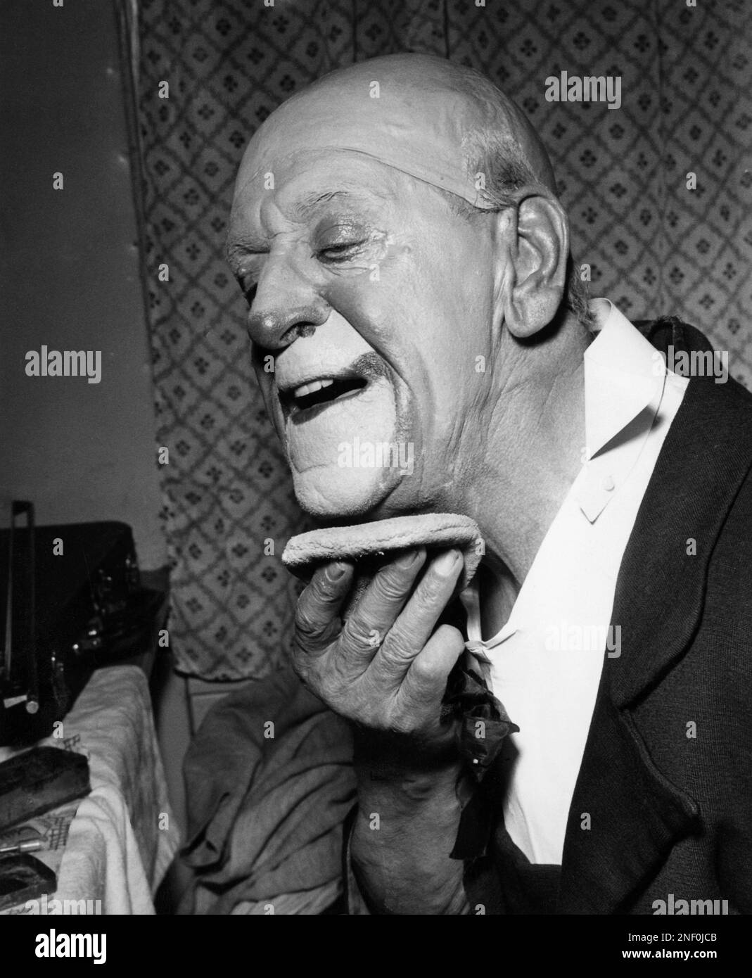 Grock, Europe's most famous clown, puts on his world famed make-up for ...