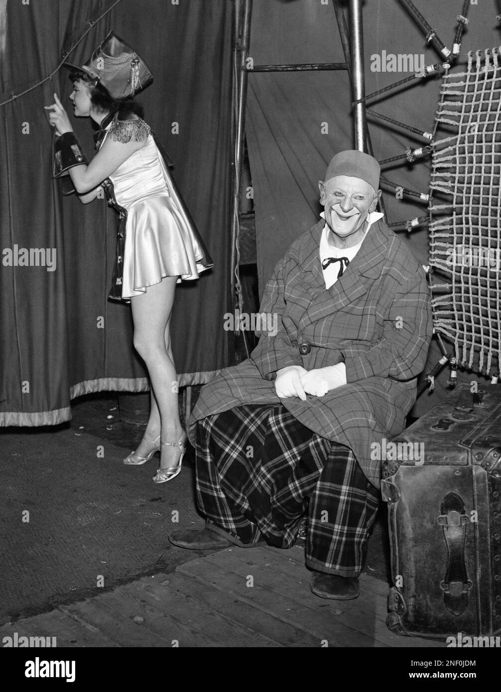 Grock, Europe's most famous clown, waits in his dressing room before ...