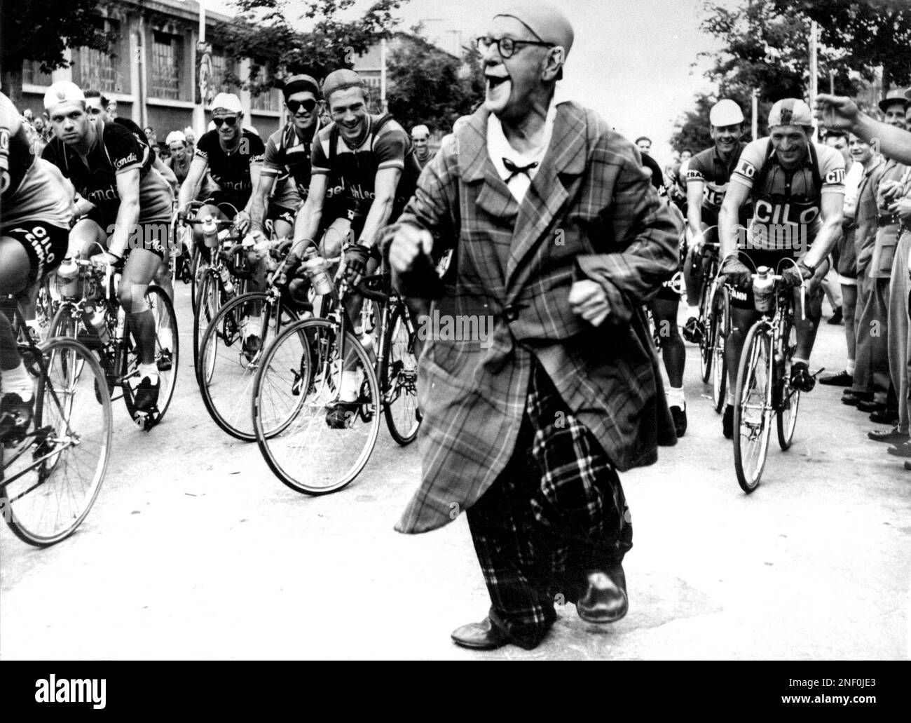 Grock, the world famous Swiss clown, gives the "off" to cyclists ...