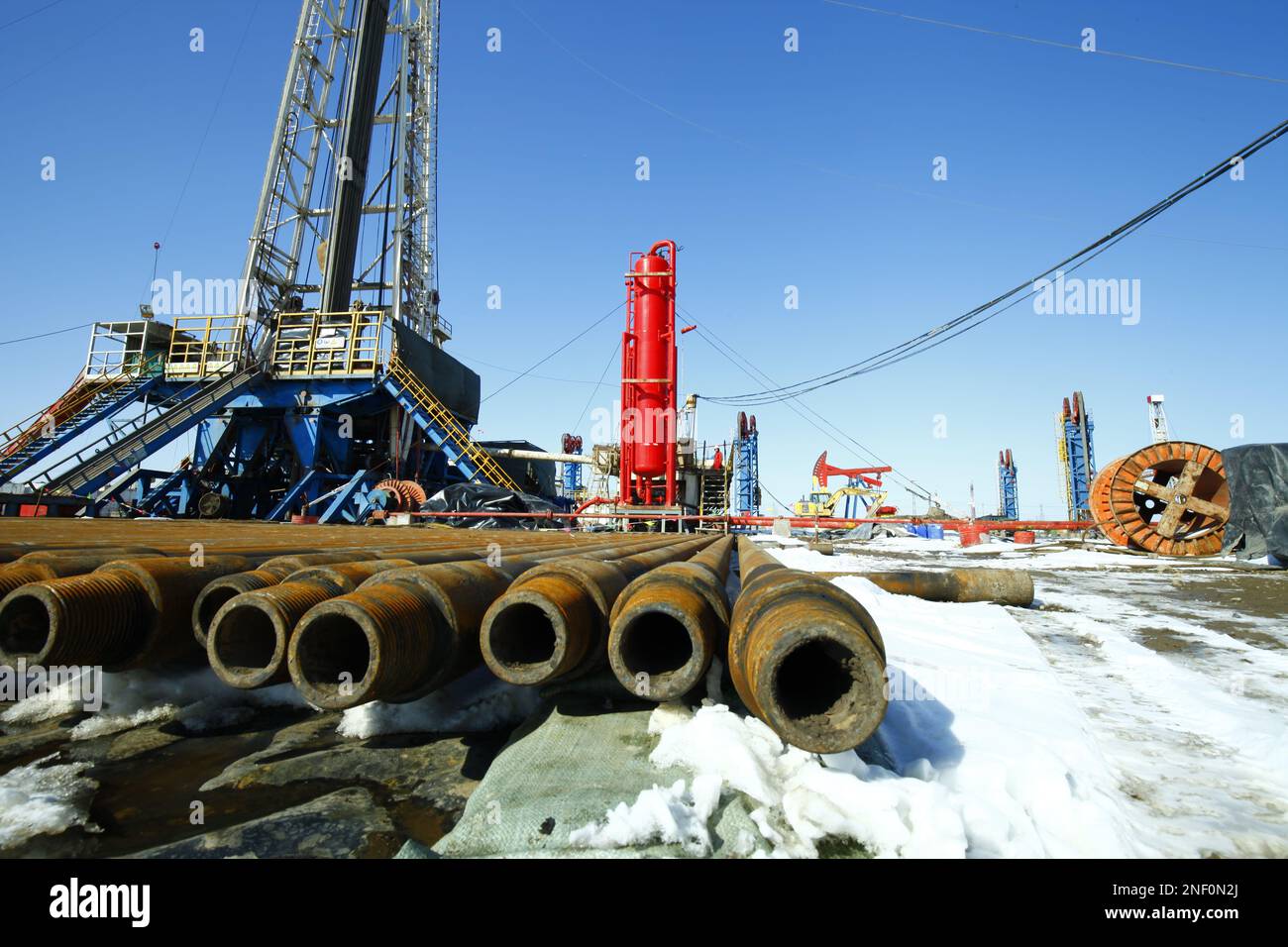 Oil drill pipe and drill Stock Photo - Alamy