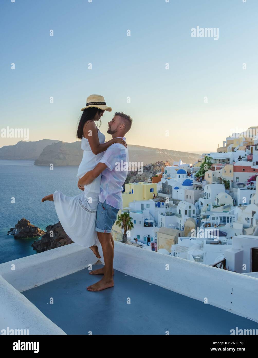Couple on vacation in Santorini Greece, men, and women on the streets ...