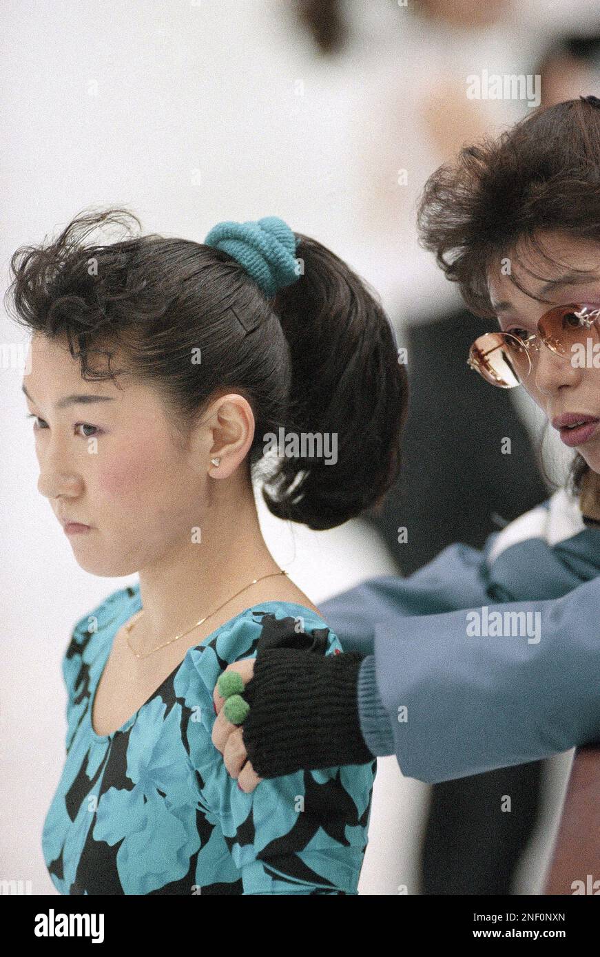Japanese figure skater Midori Ito gets rubdown from an unidentified ...