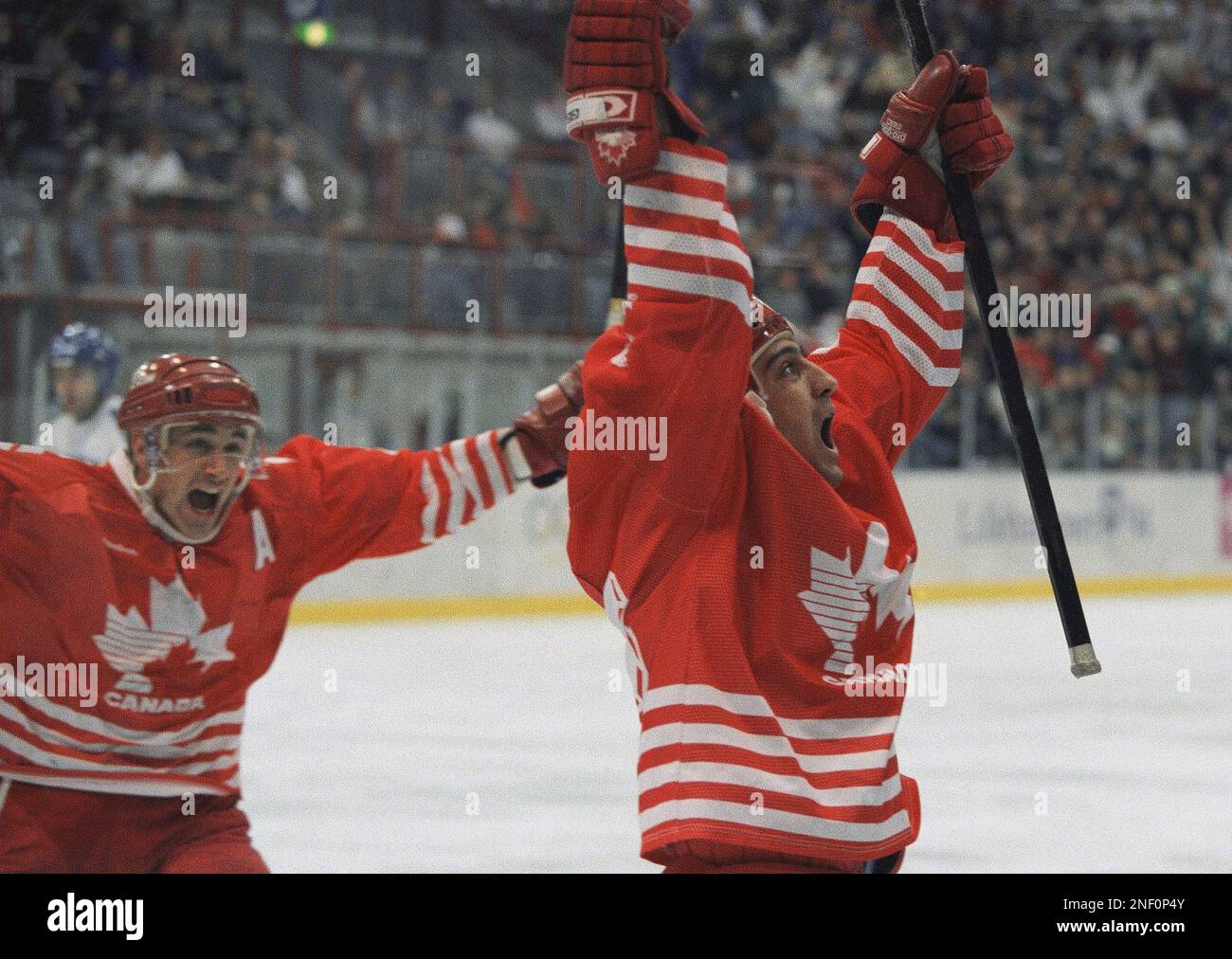 Canada’s Derek Mayer, left, and teammate Jean Yves Roy, right ...