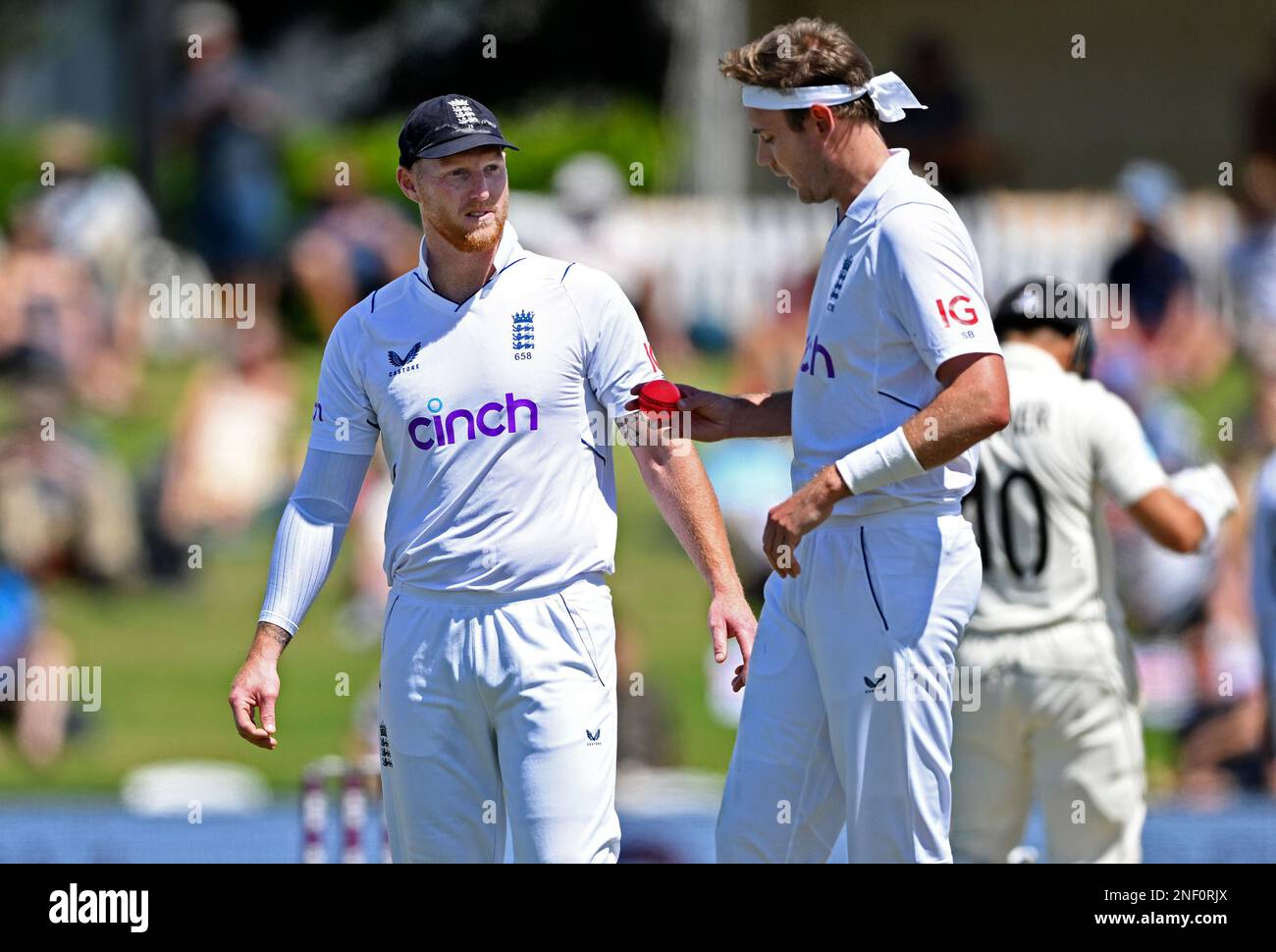 England's Ben Stokes, left, talks with bowler Stuart Broad while ...