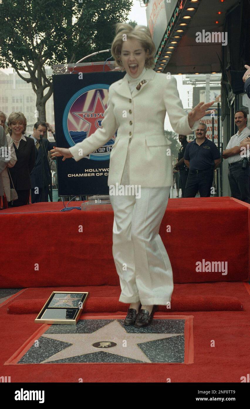 Actress Sharon Stone happily jumps up and down, becoming the first ...