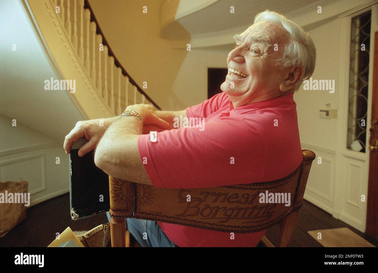 Veteran actor Ernest Borgnine laughs while sitting for a portrait in ...
