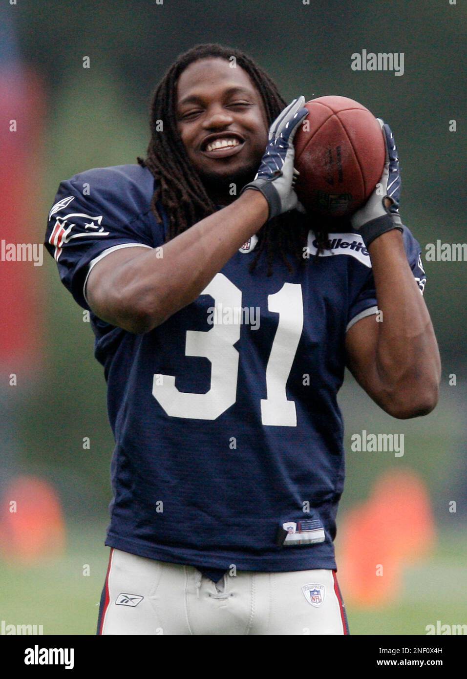 New England Patriots safety Brandon Meriweather catches a ball during ...