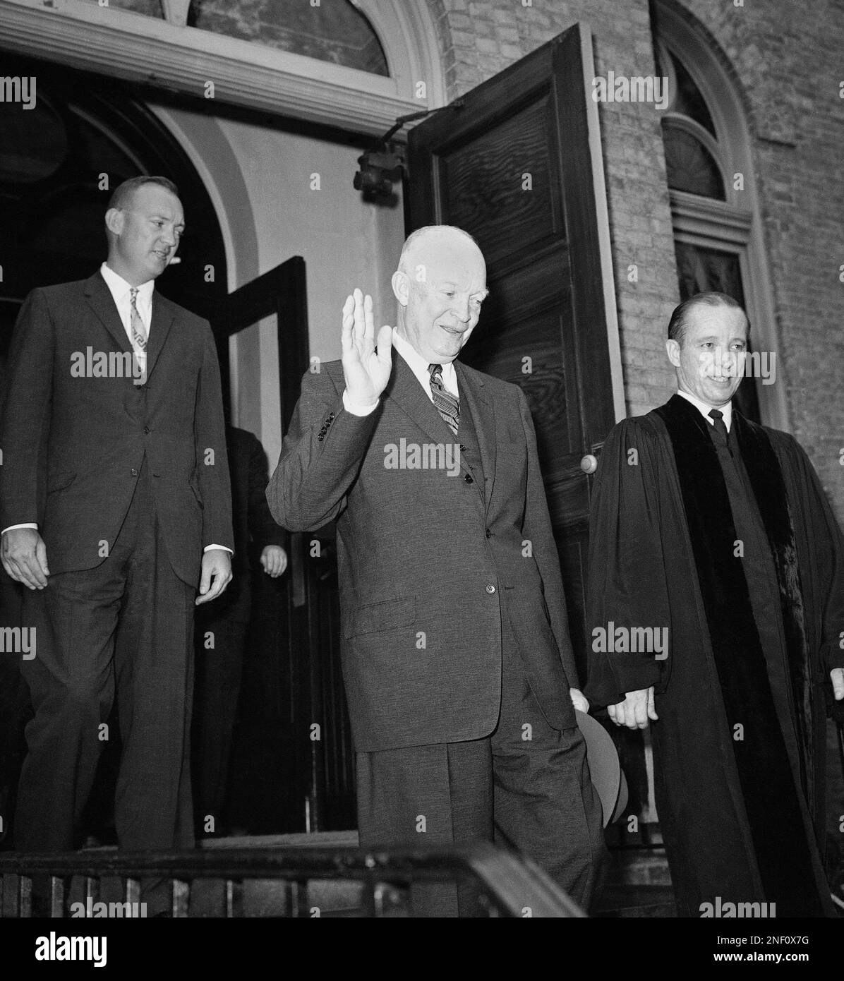 President Eisenhower salutes small rain-dampened crowd from steps of ...