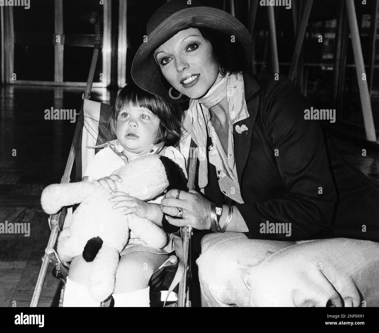 Actress Joan Collins is shown with her daughter, Katyana Kass, 2, at ...