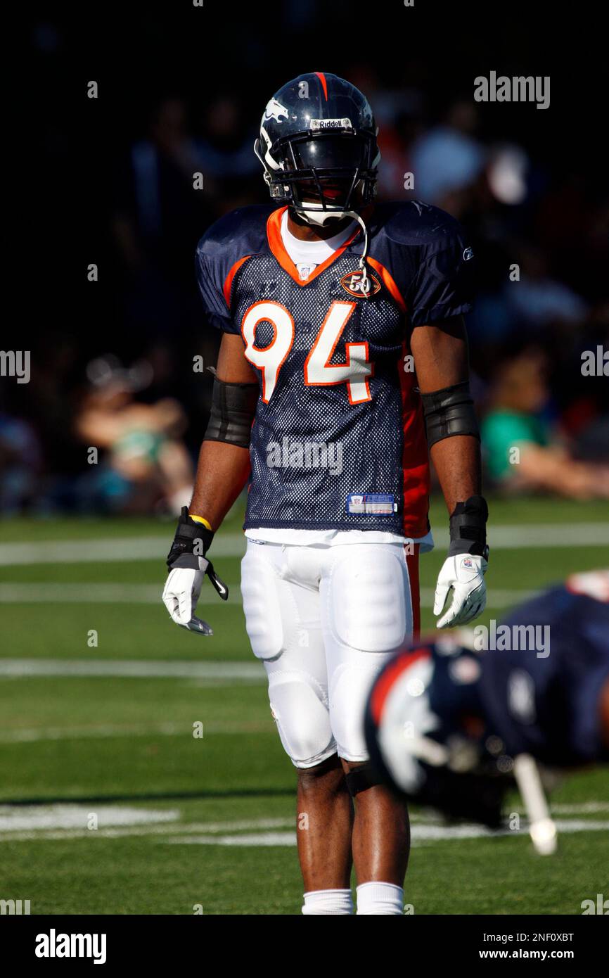 Denver Broncos linebacker Jarvis Moss takes part in drills during the ...