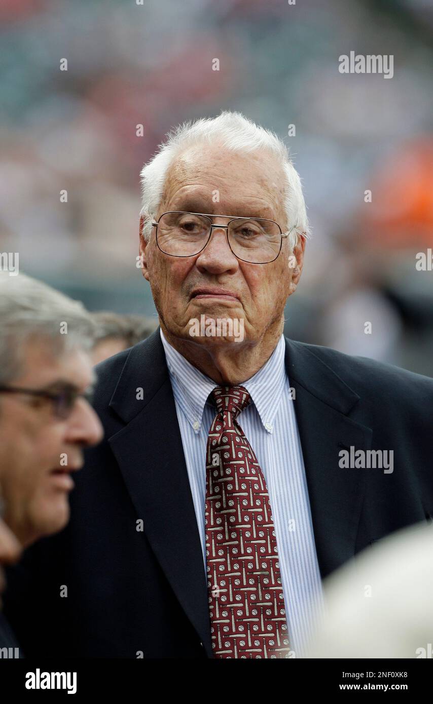 Hall of Fame pitcher Bob Feller looks on before a baseball game between ...