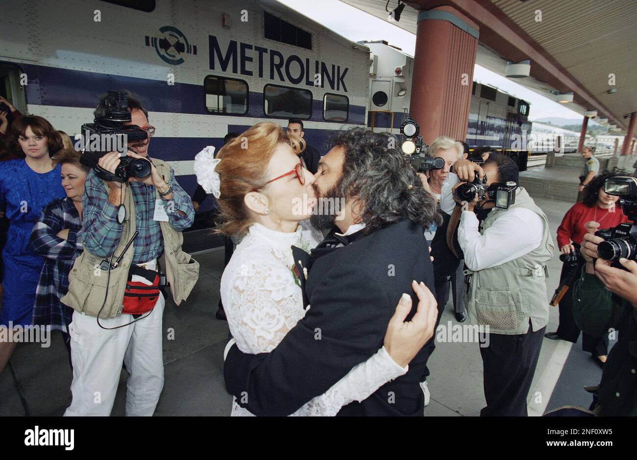 Newly-weds Elizabeth Paulos and Peter Boggs share a passionate kiss on ...