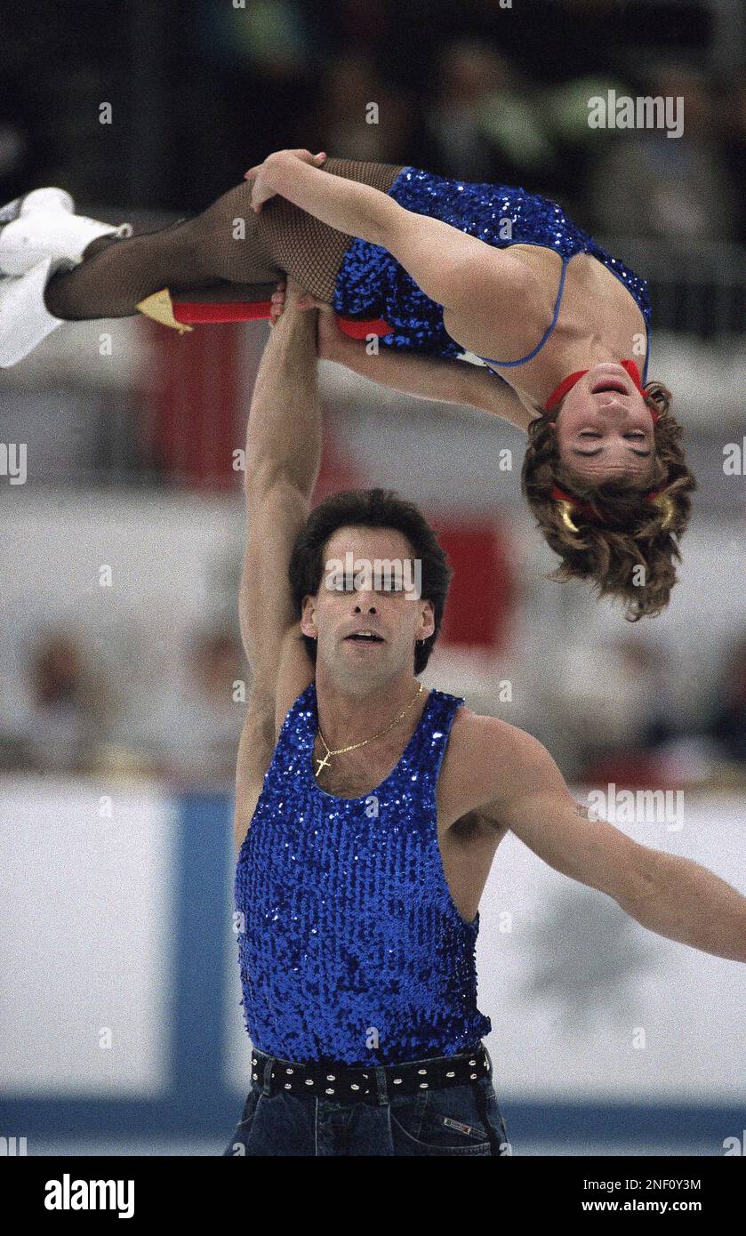 Canadian figure skater Lloyd Eisler lifts his partner, Isabelle ...