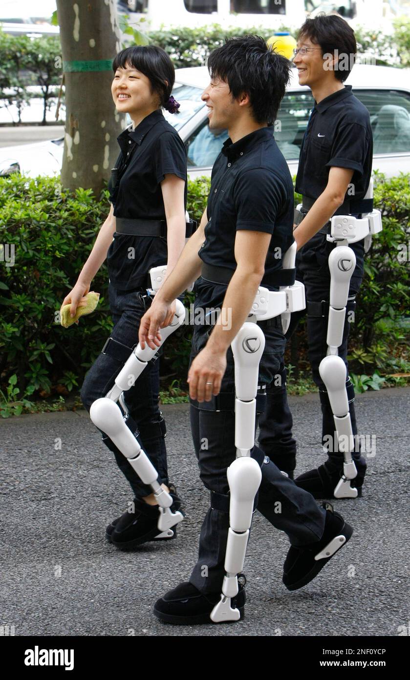 Cyberdyne Inc. employees, from left, Fumi Takeuchi, Takatoshi Kuno and ...