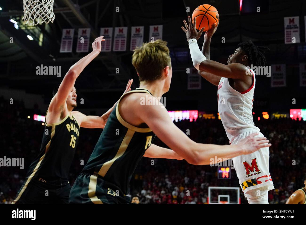 Maryland guard Hakim Hart, right, shoots against Purdue center Zach ...