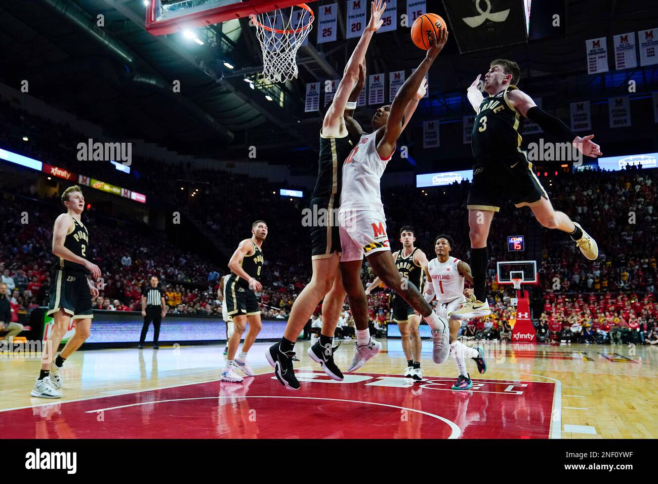 Maryland forward Julian Reese, center right, goes up for a shot against ...