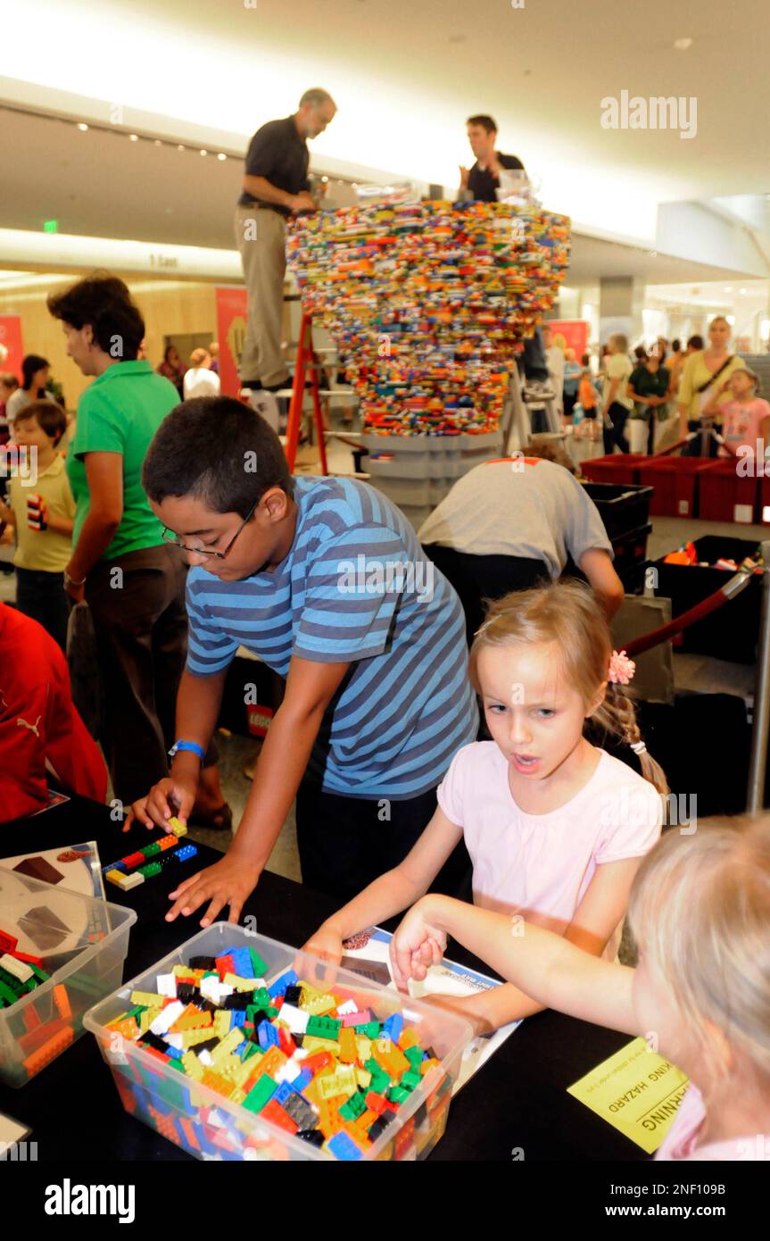 Children help to build an 8-foot lego light bulb in honor of National ...
