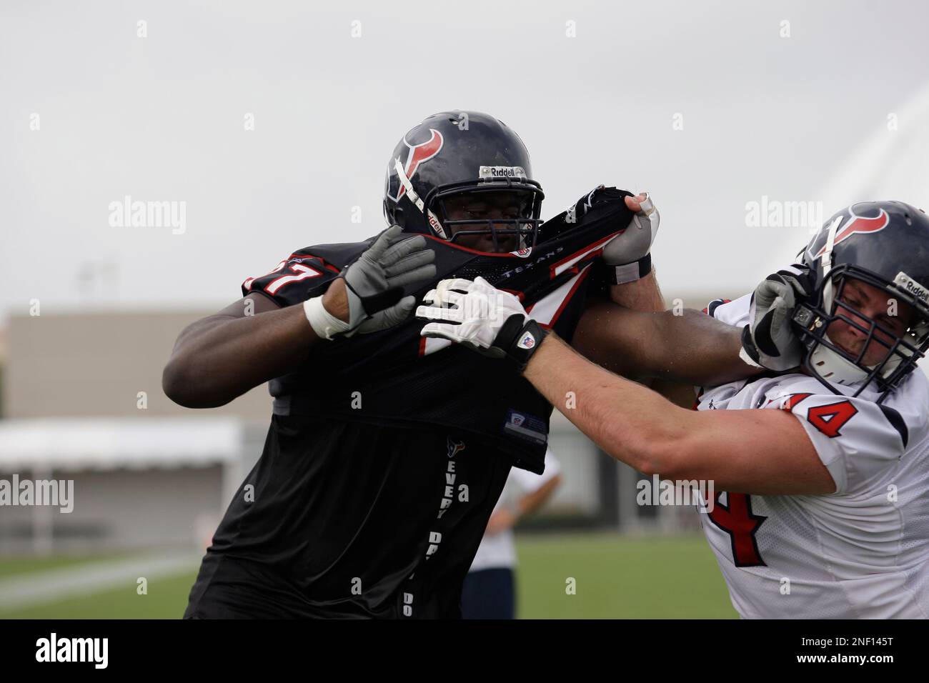 Houston Texans defensive tackle Frank Okam (97) and center Brett Helms ...
