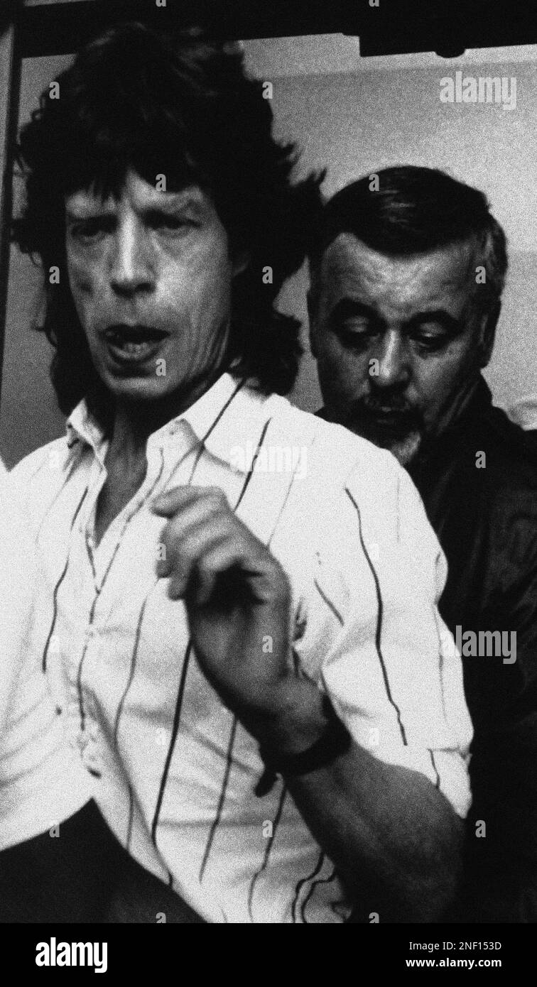 Rock singer Mick Jagger, left, leaves Magistrate’s Court in Barbados ...