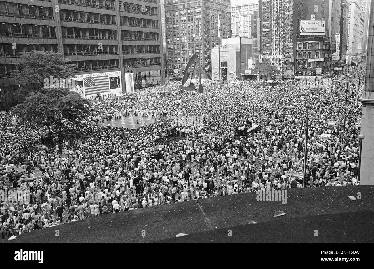 Apollo 11 Astronauts, at left under flag, are surrounded by Chicago ...