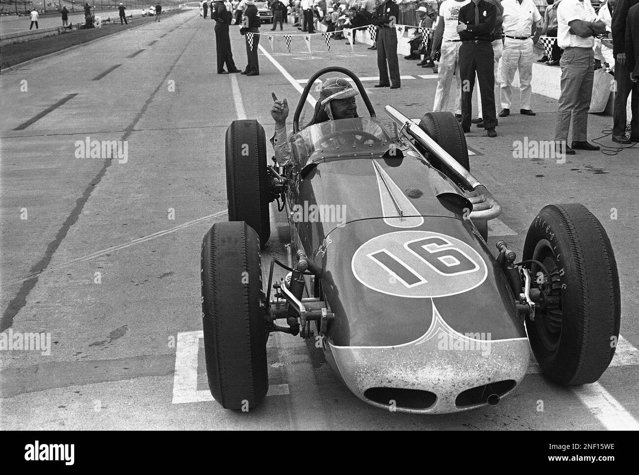 Jim Rathmann of Melbourne, Fla., poses in his car after qualifying for ...
