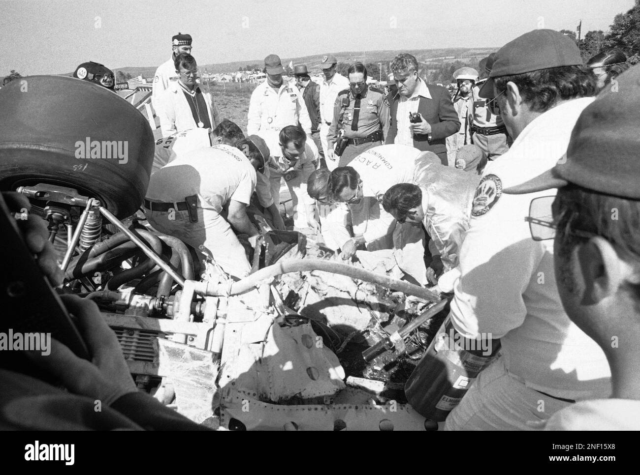 Race workers remove the body of French race driver Francois Cevert from ...