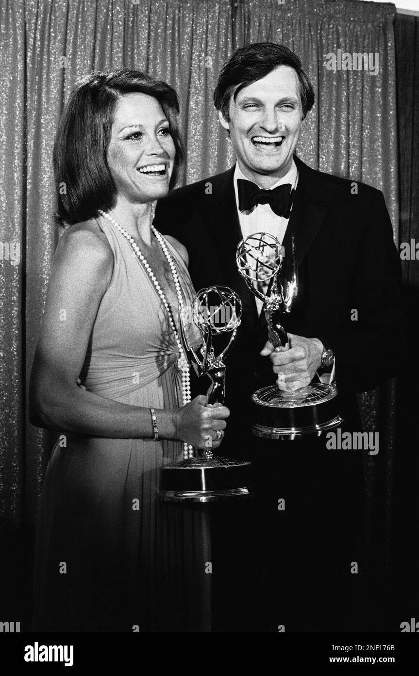 Standing holding trophy smiling fame achievement hi-res stock ...