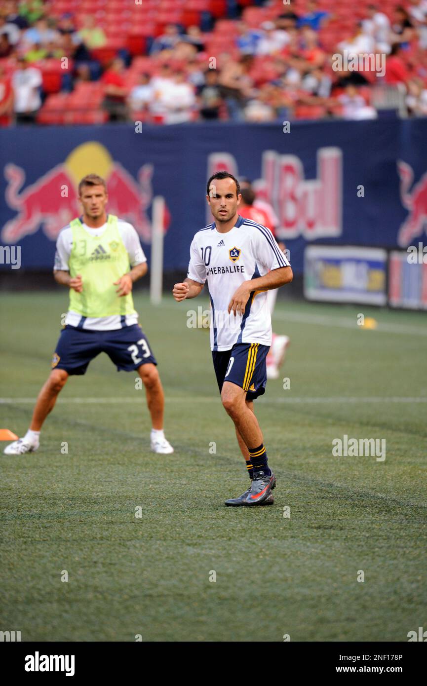 Los Angeles Galaxy midfielder Landon Donovan loosens up a David Beckham ...