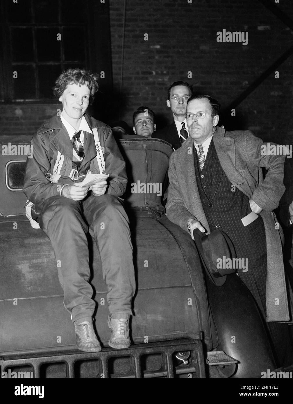 Amelia Earhart poses with her husband George P. Putnam after completing ...