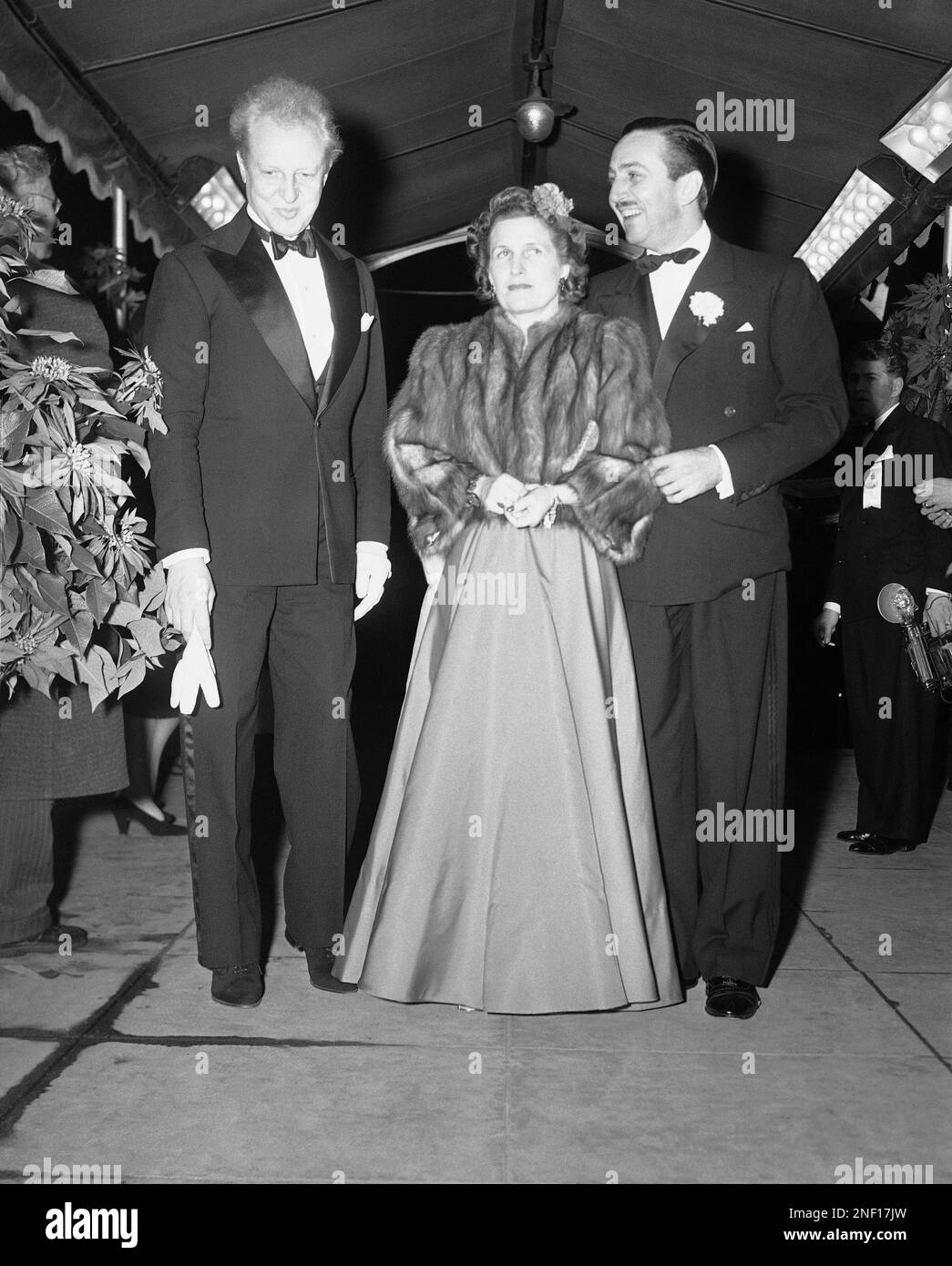 Shown in photo from Left to right are: Leopold Stokowski, Mrs. Walt ...