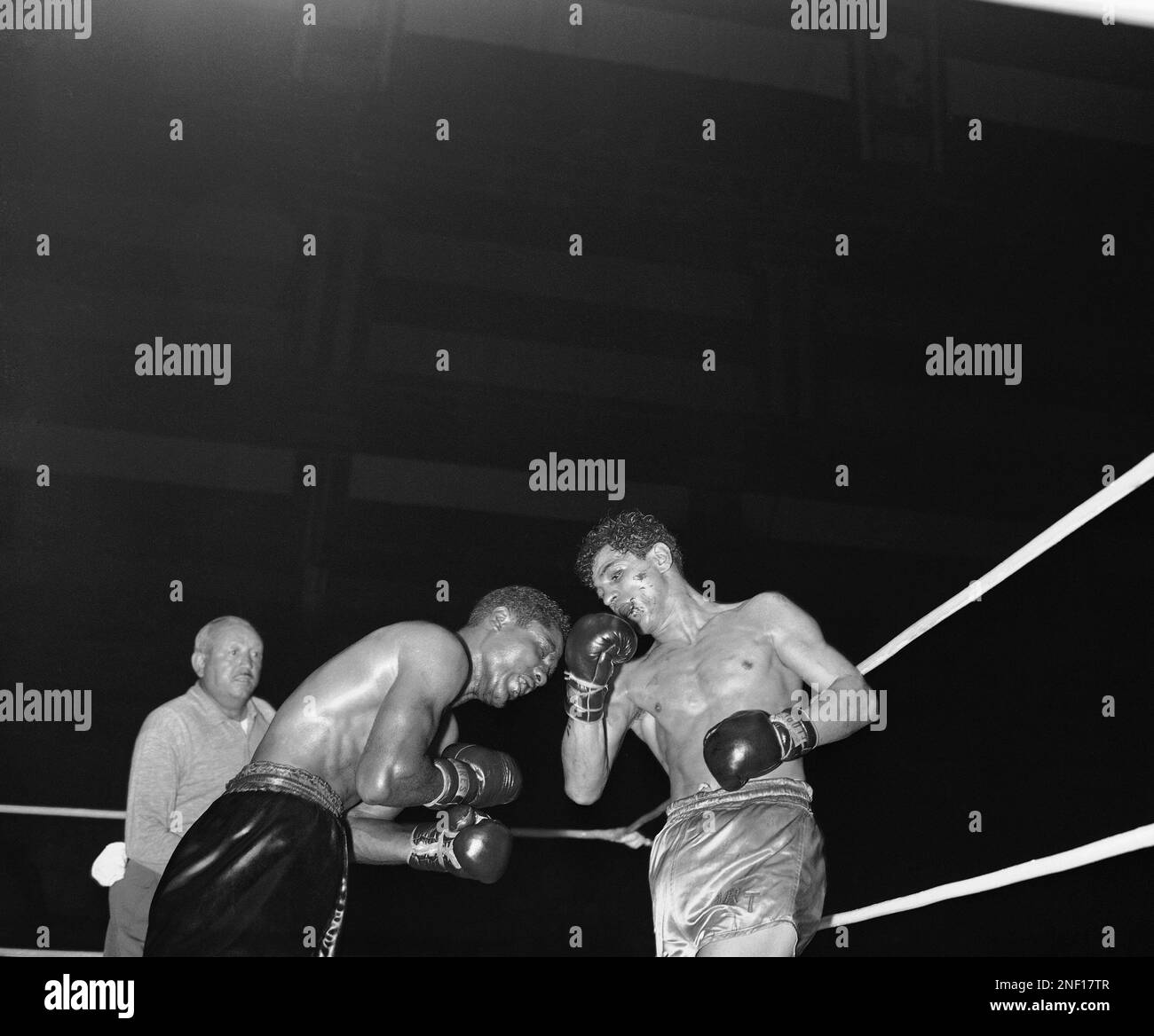 Henry Davis Left Winces After A Blow To The Face By Art Aragon In The