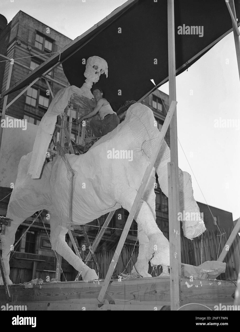 This enormous figure of death with a Hitlerian brush of hair across the ...