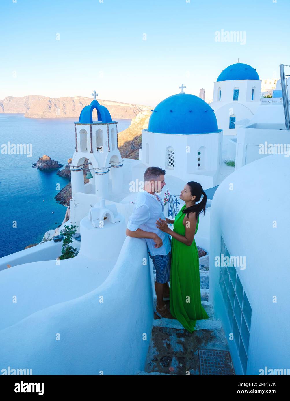 Couple on vacation in Santorini Greece, men and women visit the ...
