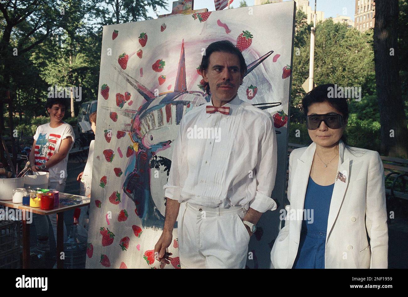 Artist Peter Max, left, and Yoko Ono pose in Strawberry Field at ...