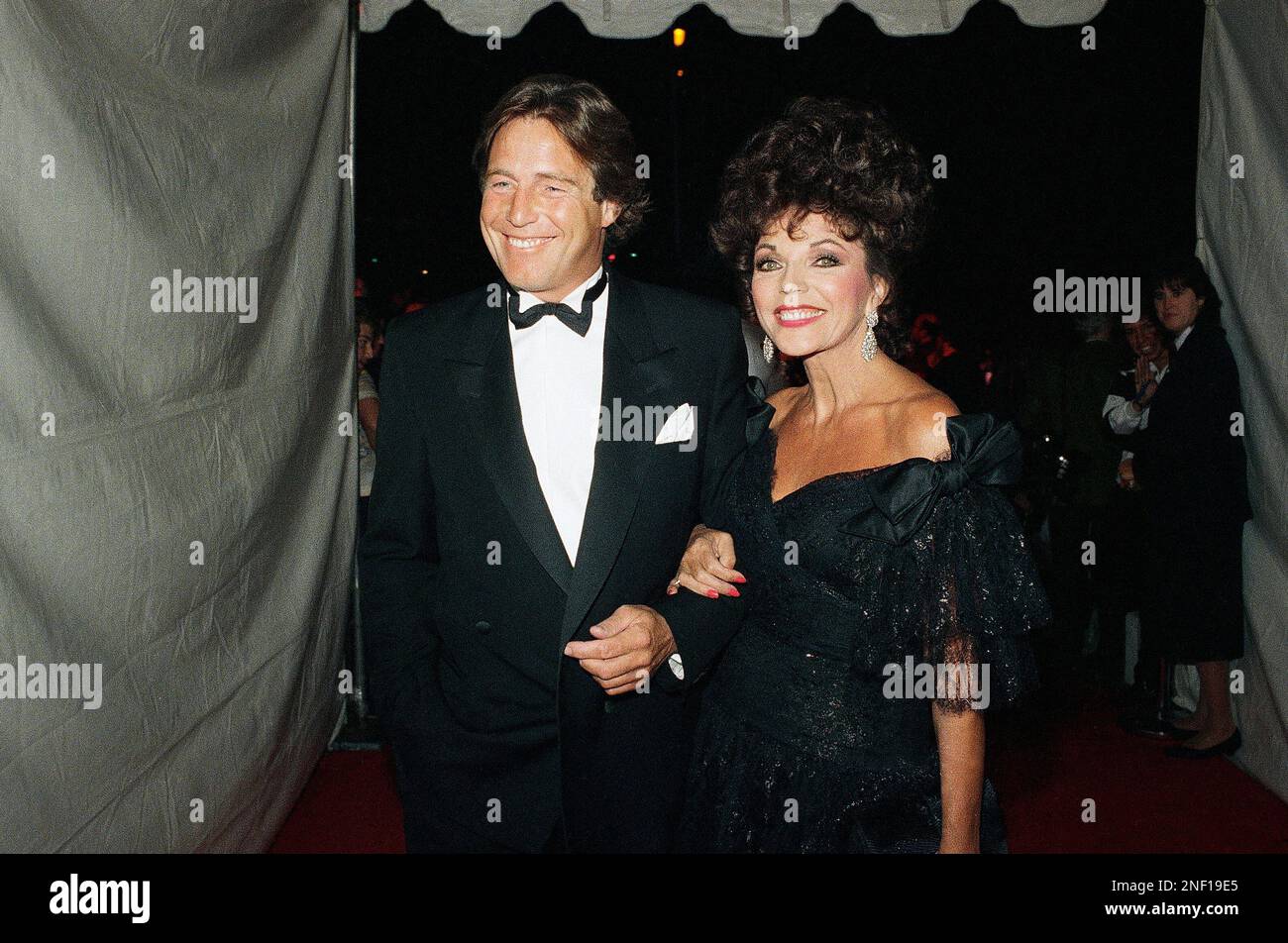 Actress Joan Collins with her boyfriend, Bill Wiggins, arrives, Nov. 23 ...