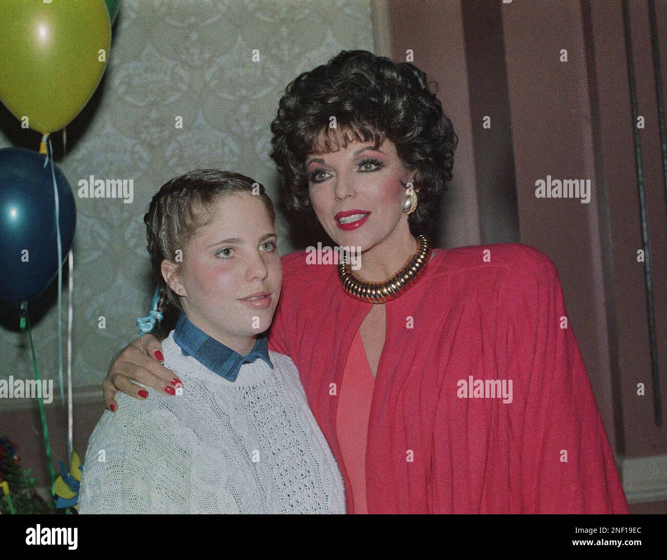 British actress Joan Collins is shown with her daughter Katie, March 28 ...