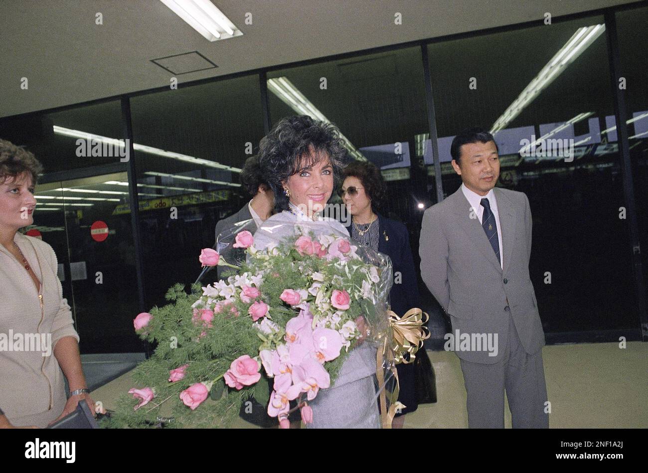 American actress Elizabeth Taylor smiles upon her arrival in afternoon ...