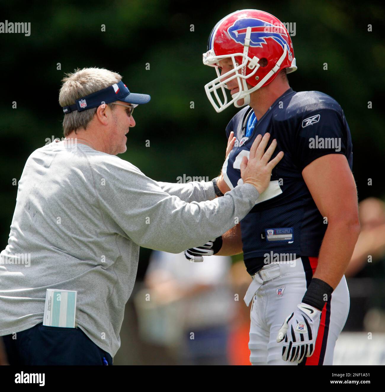 Buffalo Bills' Ryan Denney works with defensive line coach Bob Sanders ...