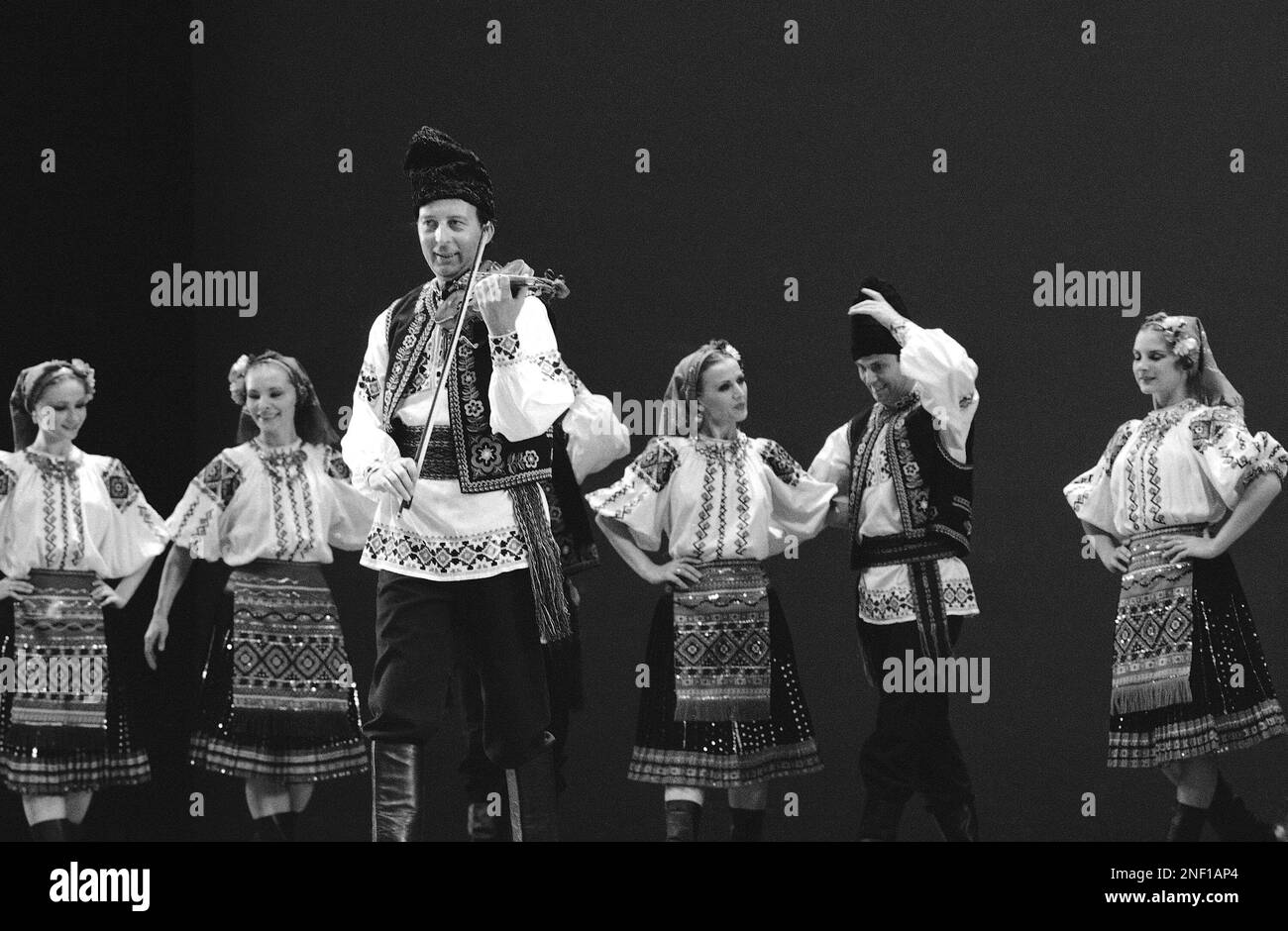 Members of the Moiseyev Dance Company perform part of an episode from ...
