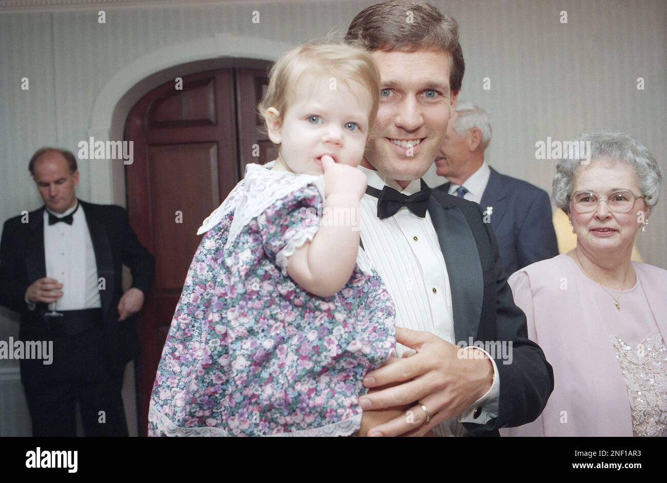 Shown in photo is Olympic speed skater Dan Jansen with daughter shown ...