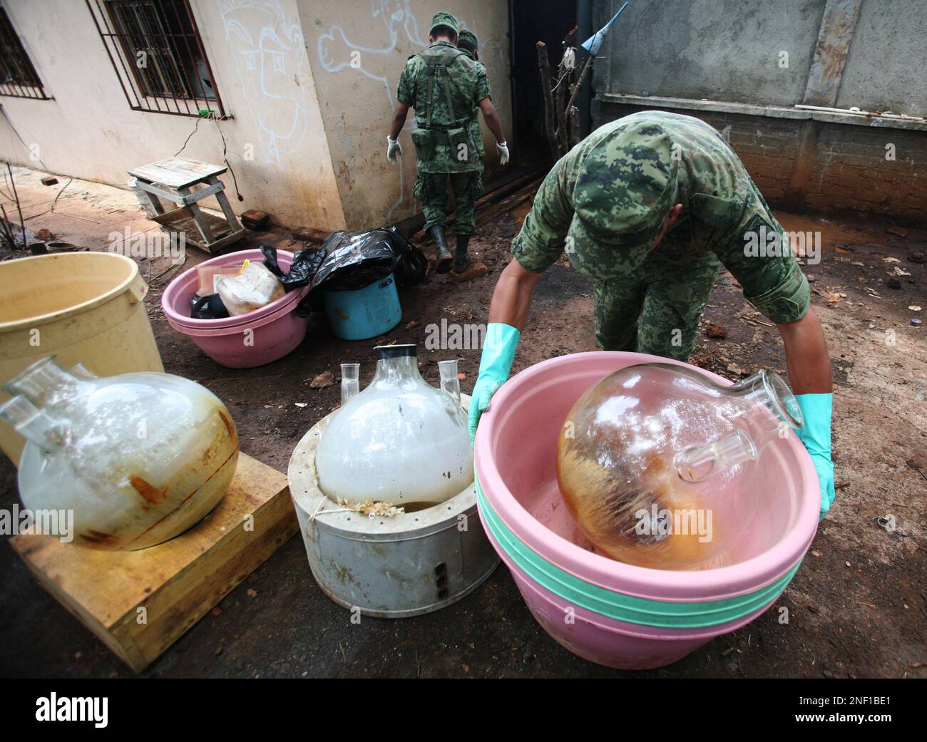 Mexican army soldiers take away laboratory equipment used to produce ...