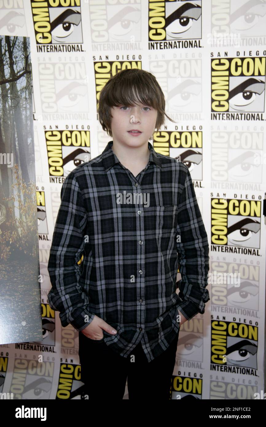 Actor Max Records poses next to a poster for his new movie "Where the ...