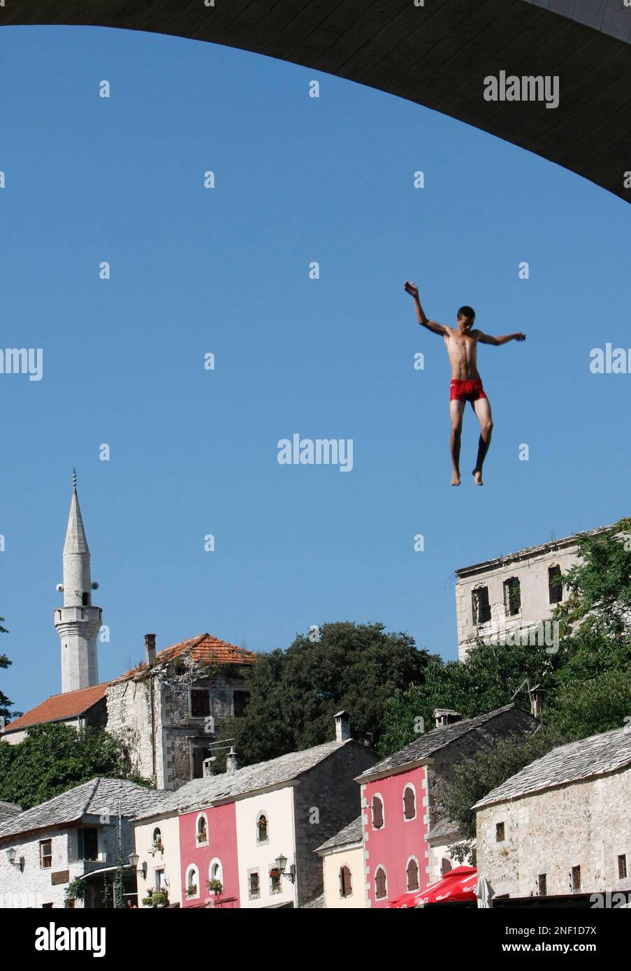 Diver flies during traditional qualification jump from the Old Mostar ...