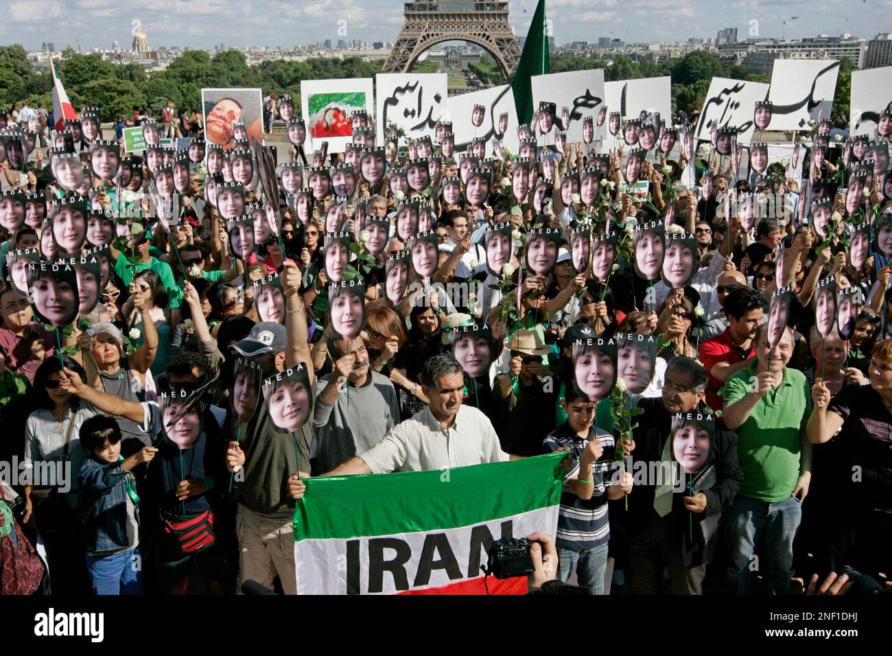 People hold placards bearing images of Iranian Neda Agha Soltan, the 27 ...