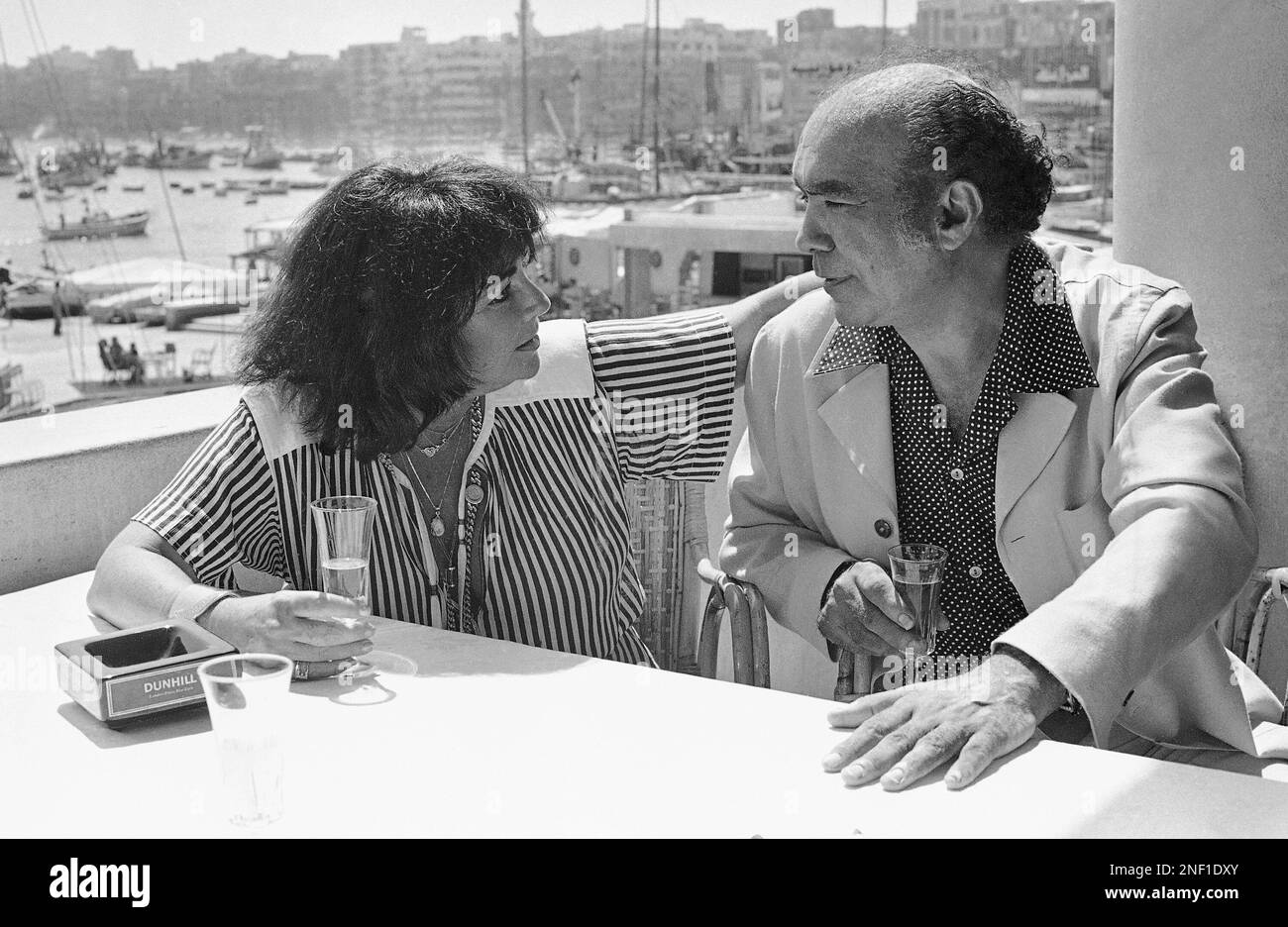 Actress Elizabeth Taylor talks with Kamel El Mallakh on the porch of ...
